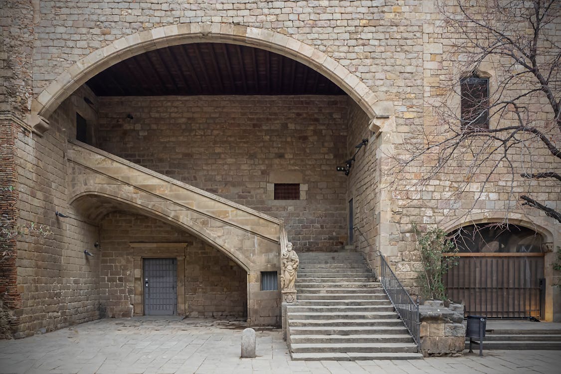 Stone architecture of an ancient courtyard in Barcelona Gothic Quarter