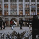 The Madame Tussauds building facing Dam Square in Amsterdam with visitors gathered outside