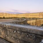 Palace of Versailles golden facade glowing at sunset
