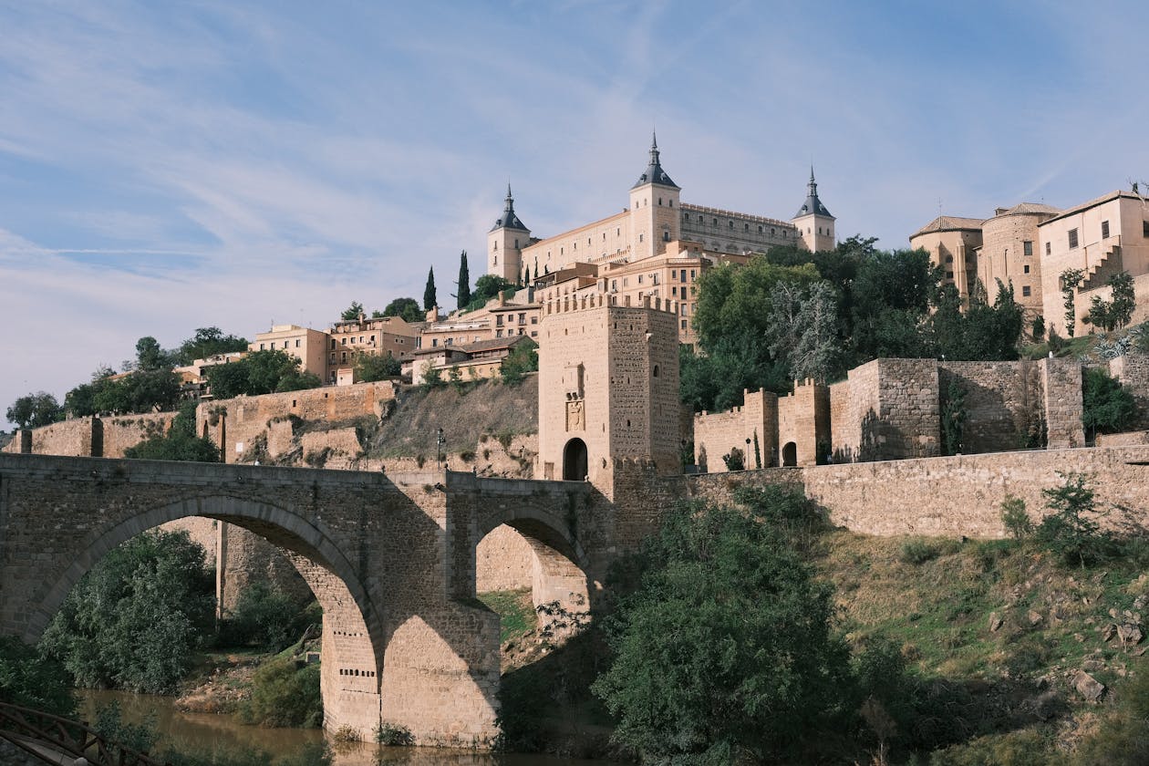 Aerial view of Alcazar and ancient bridge over the Tagus River in Toledo Spain