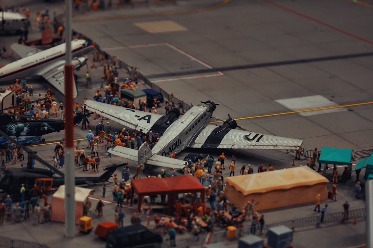 Detailed miniature scene of airplanes and people at a crowded airport display