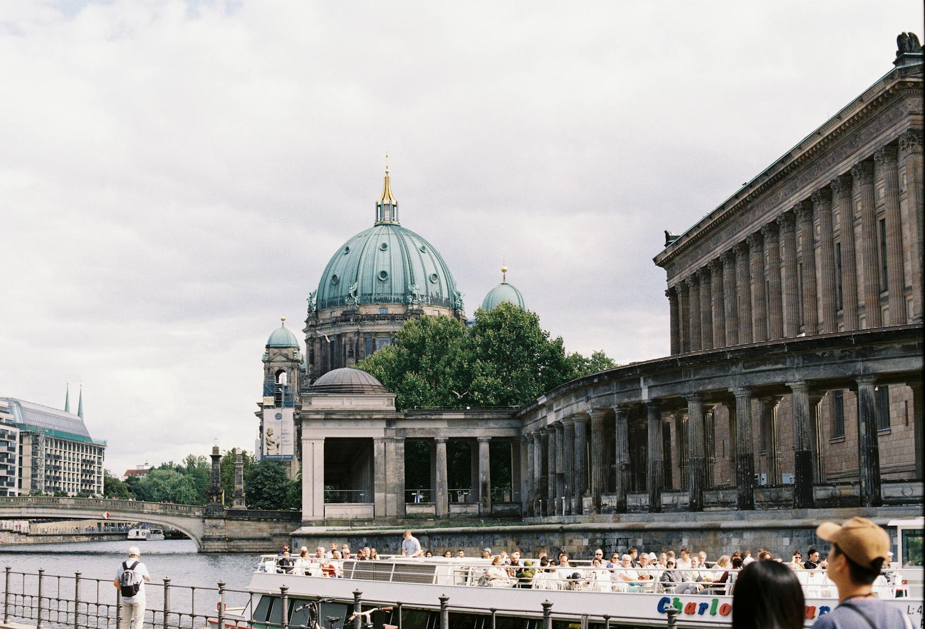 Berlin Cathedral and river cruise creating a picturesque urban scene