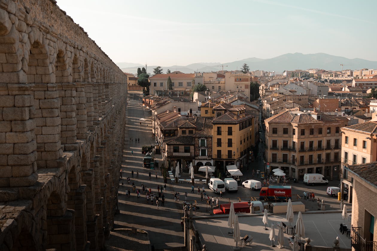 Panoramic view of Segovia with iconic aqueduct and city buildings in Spain