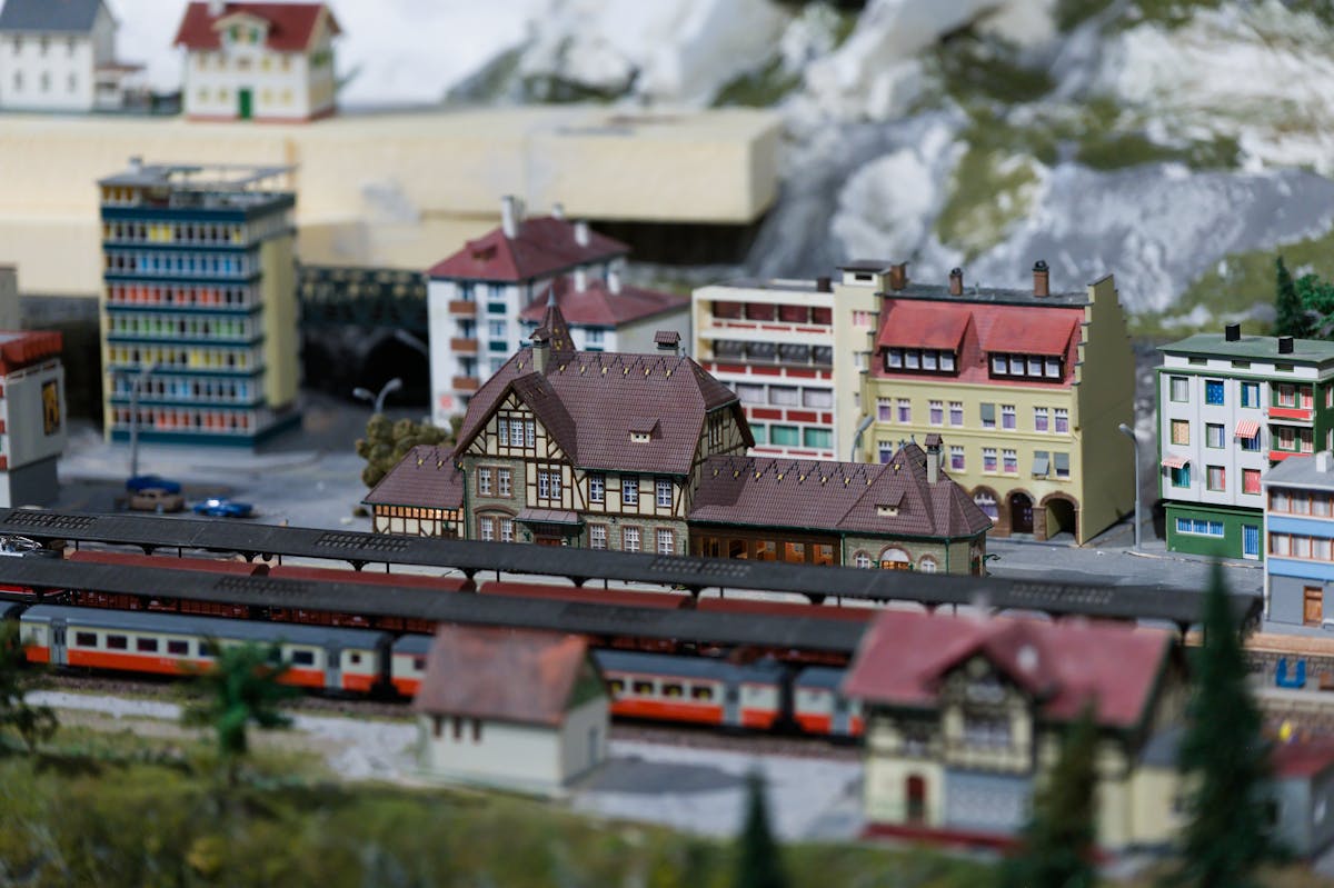 Detailed model of a European train station with surrounding buildings