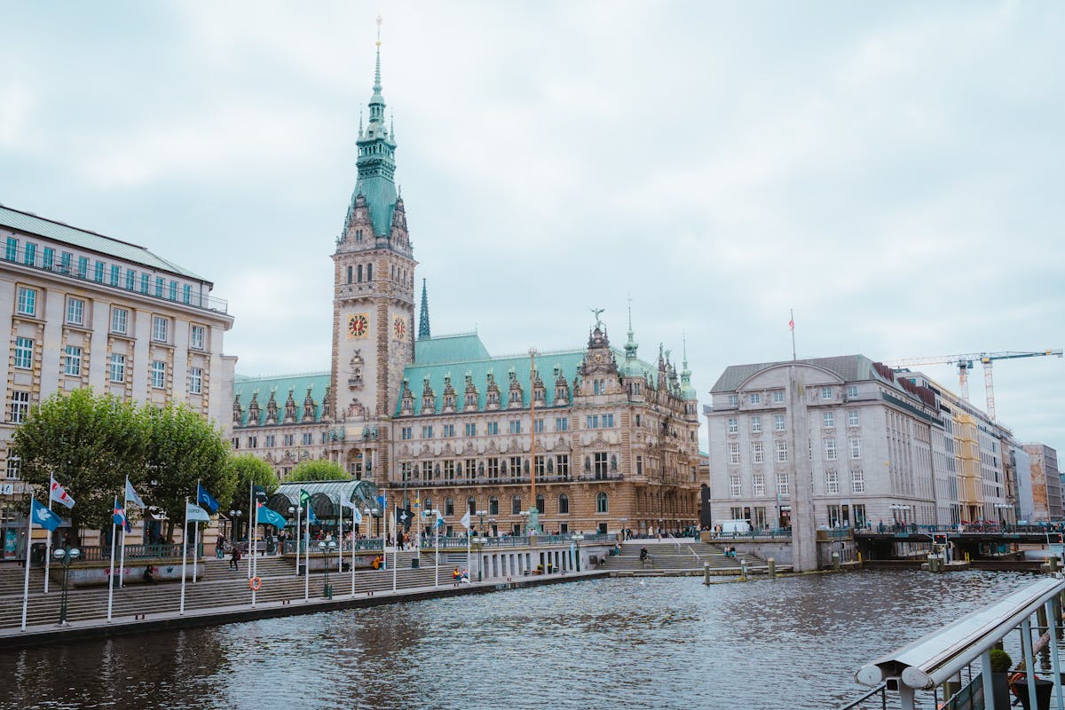 Scenic view of Hamburg Town Hall with canal and classic European architecture