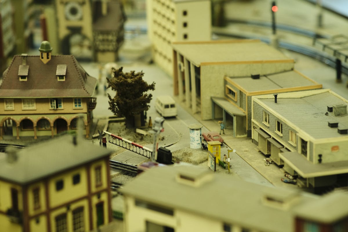 Intricate model town showcasing buildings and a railway track