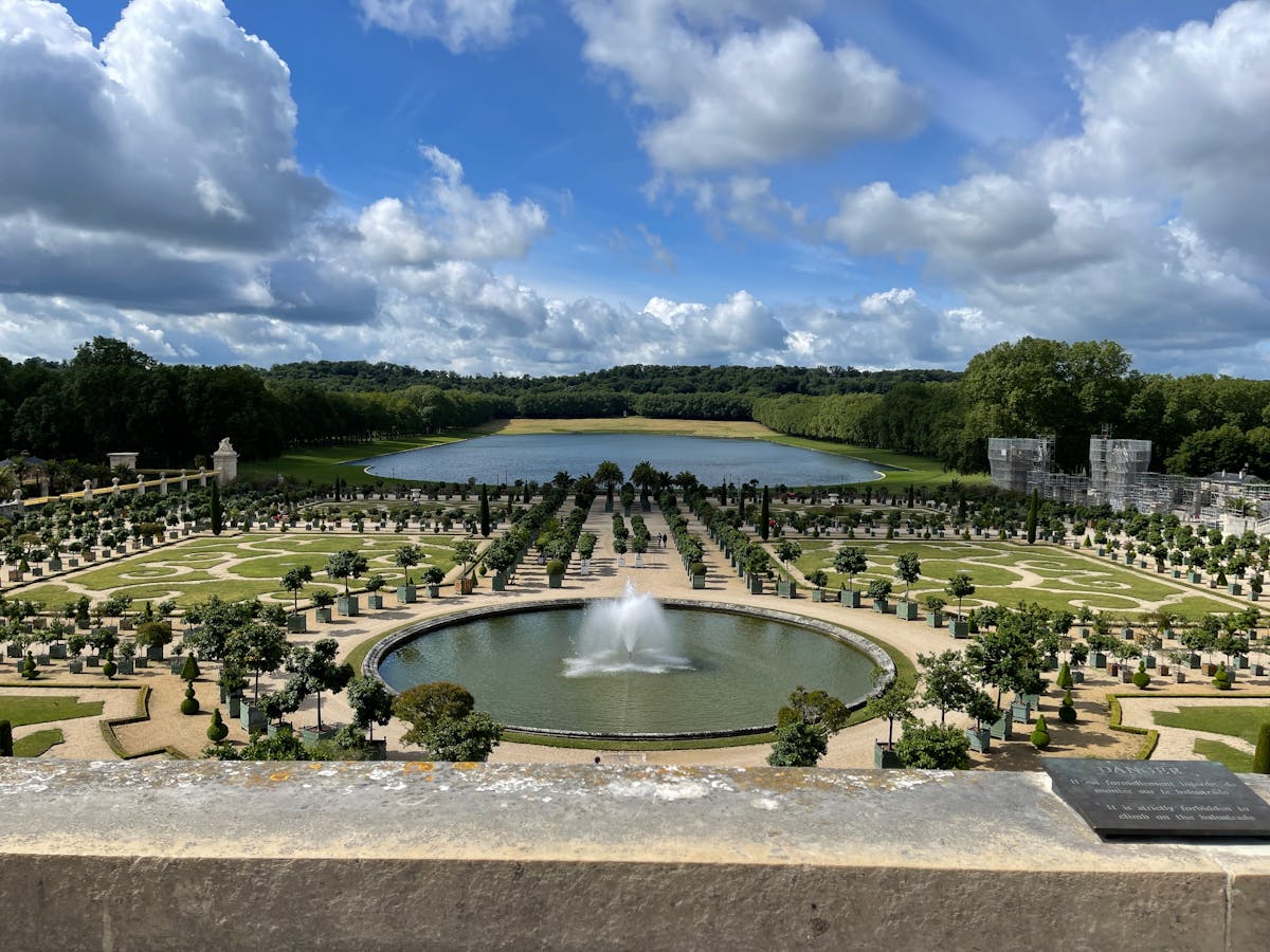 Aerial view of the perfectly symmetrical gardens and fountains at Versailles