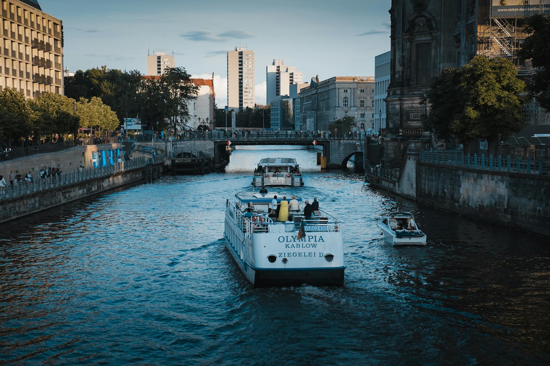 Picturesque canal in Berlin with boats and modern architecture