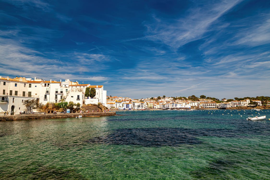 Picturesque coastal view of Cadaques village in Catalonia with blue skies