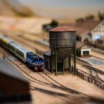Detailed miniature train model in a realistic railway station setting