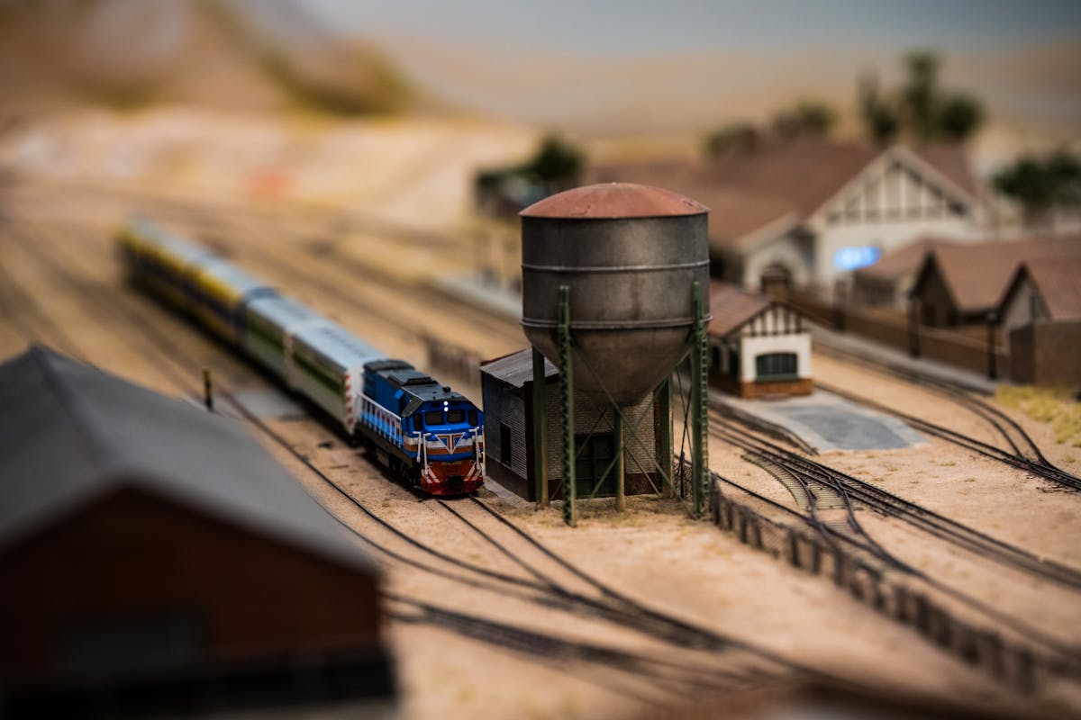 Detailed miniature train model in a realistic railway station setting