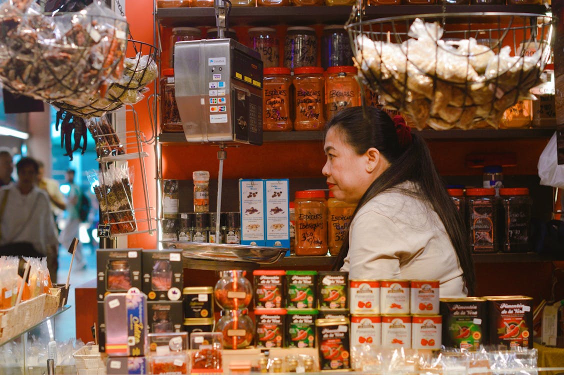 An artisan spice market stall in Barcelona Spain showcasing colorful spices