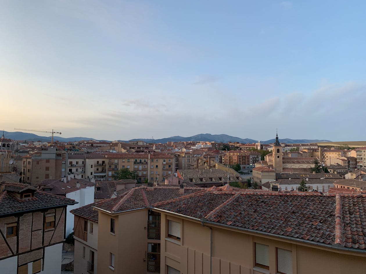 Stunning sunset view of Segovia skyline with historic architecture and mountains