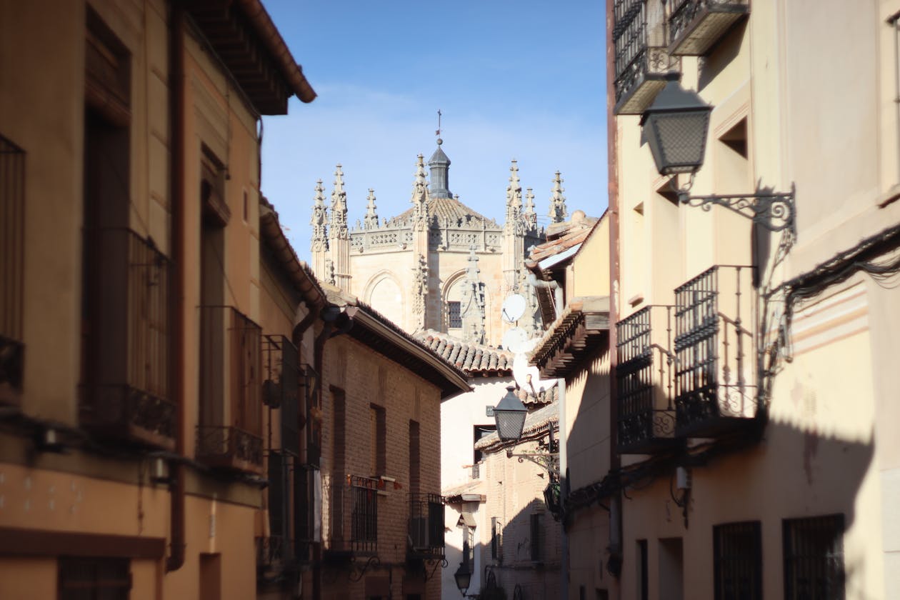 Picturesque street in Toledo Spain with view of Toledo Cathedral architecture