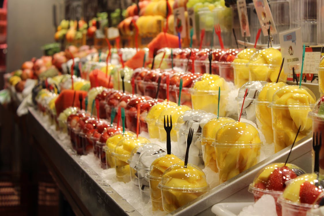 Fresh fruit cups displayed at a market in Barcelona Spain
