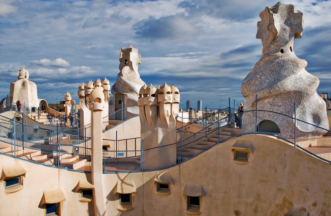 Unique rooftop of Casa Mila in Barcelona showcasing Gaudi iconic chimney sculptures