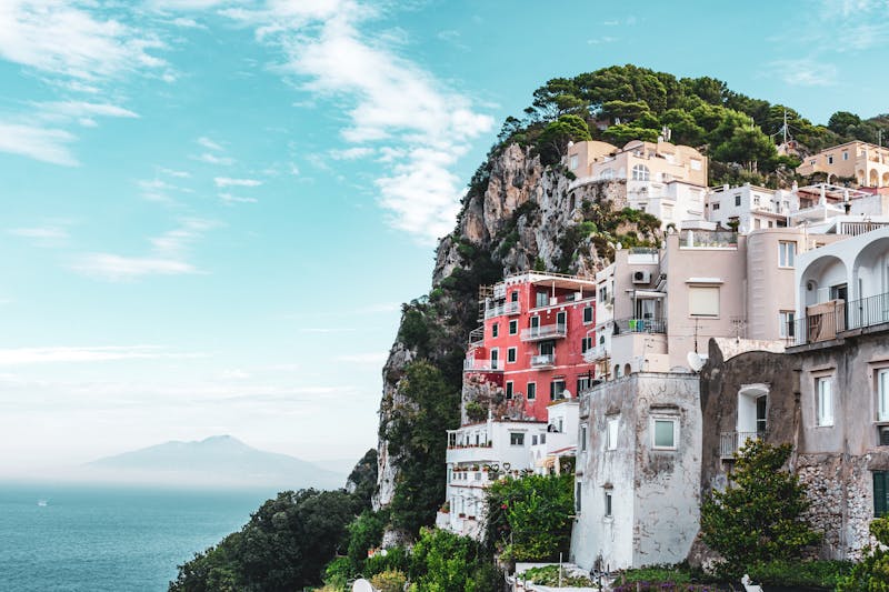 Colorful houses on the cliffs of Capri with sea in background