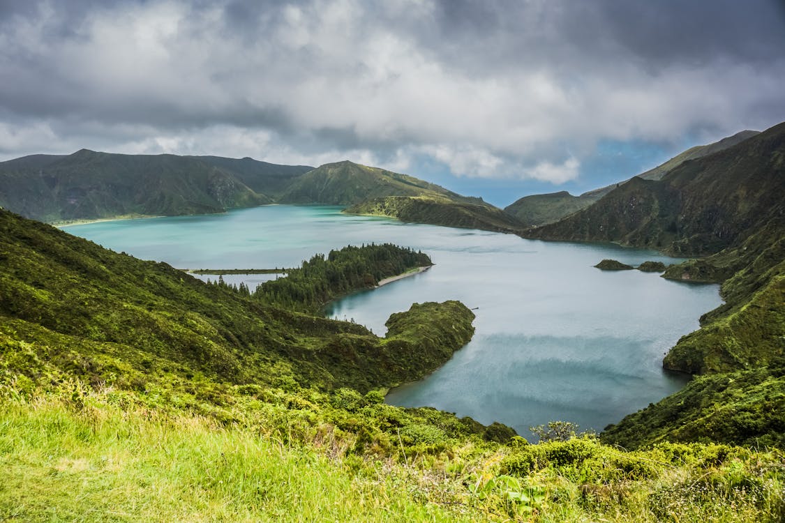 Breathtaking view of Lagoa do Fogo surrounded by mountains and greenery in the Azores