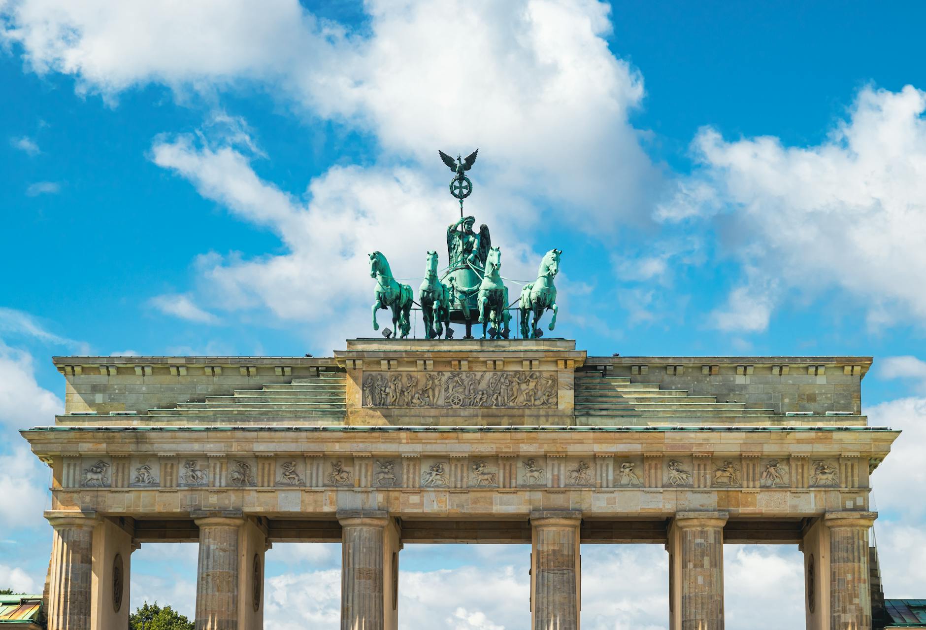 Brandenburg Gate beneath dramatic Berlin sky
