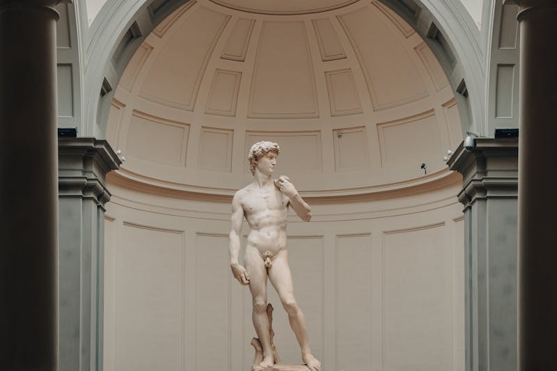 Full view of Michelangelos David statue inside the Accademia Gallery in Florence