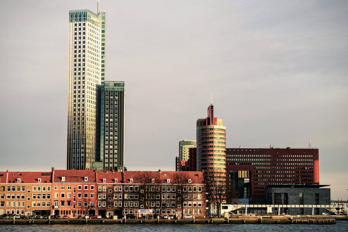 Cityscape of Rotterdam with modern high-rise buildings and skyline during daytime