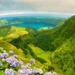 Panoramic view of Sete Cidades blue and green lakes with hydrangeas in the Azores
