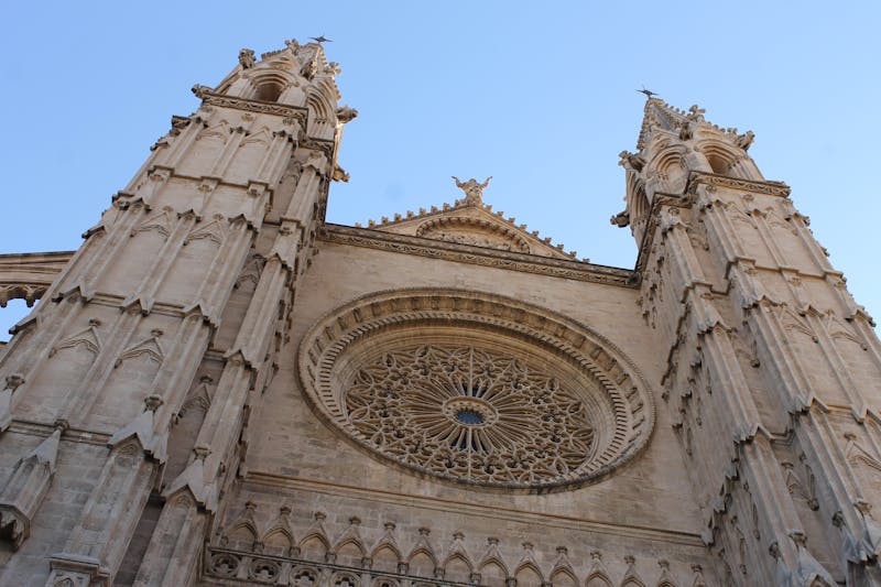 Low angle shot of the Gothic Palma Cathedral facade in Mallorca Spain