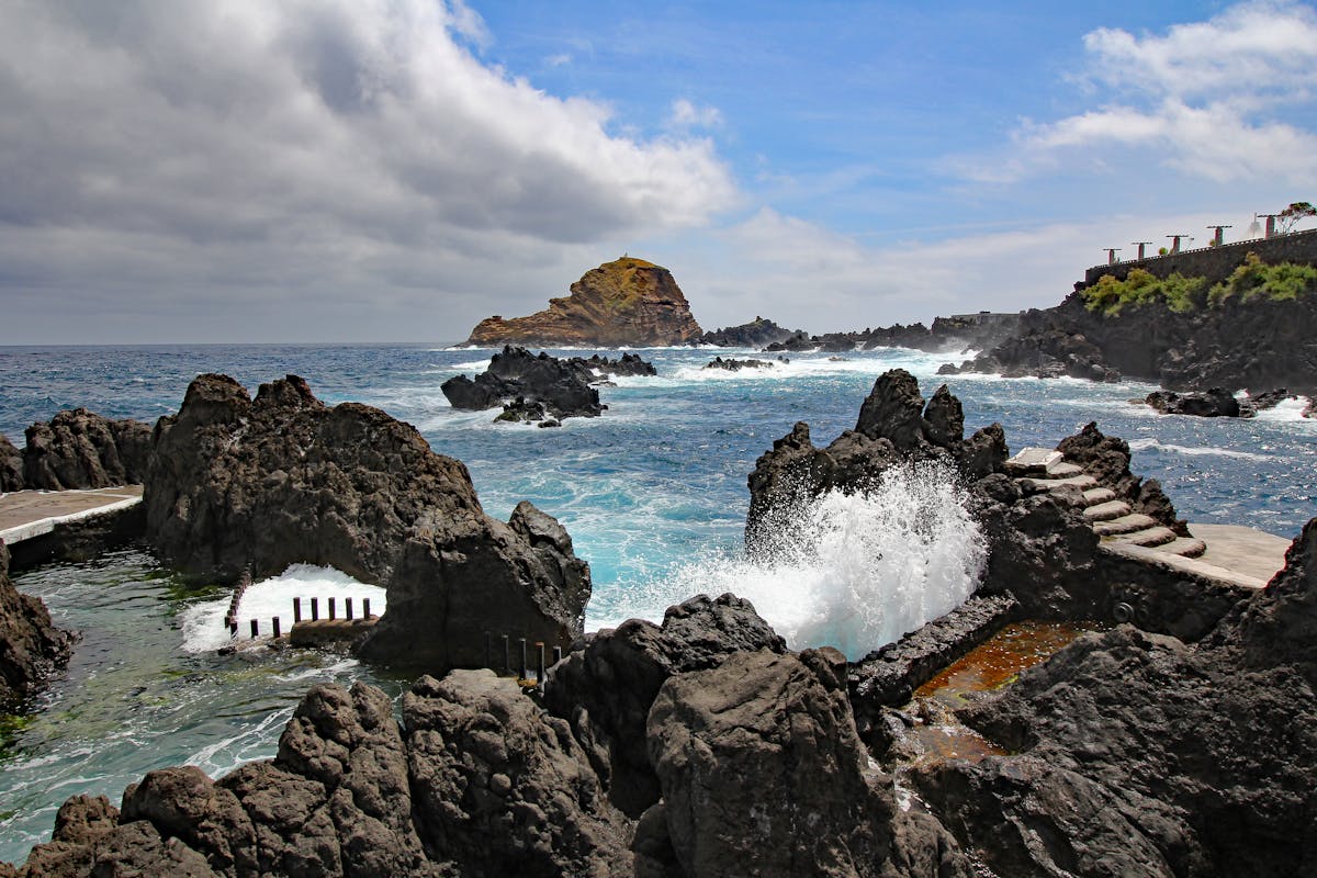 Waves crashing at Porto Moniz natural volcanic pools in Madeira