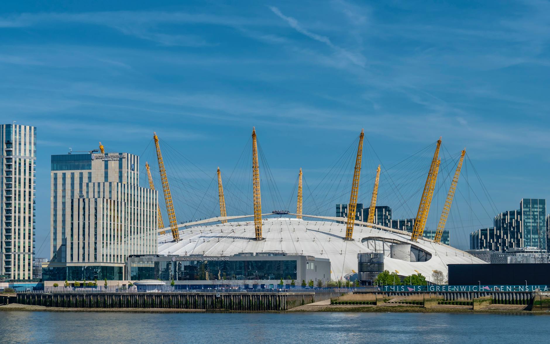 The O2 Arena dome and London city skyline seen from across the River Thames
