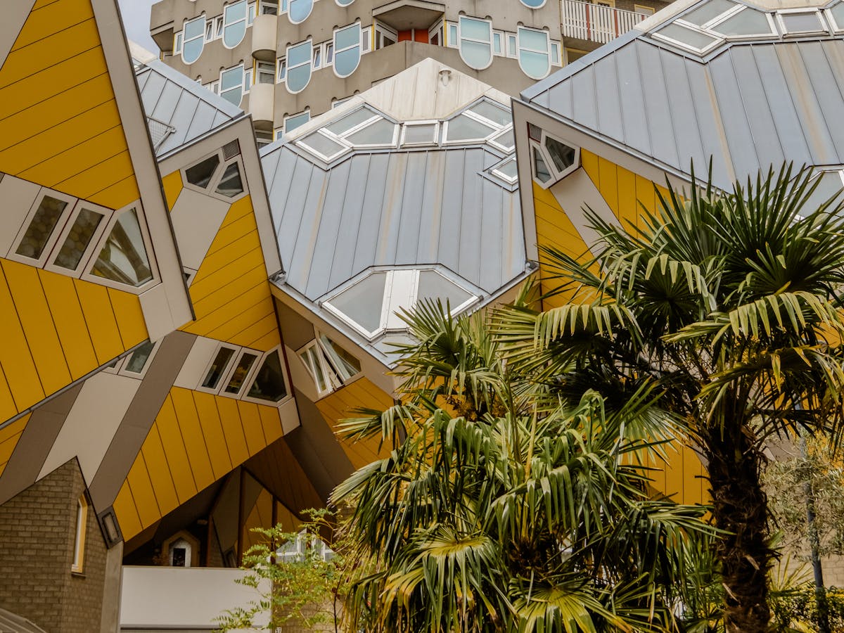 The iconic yellow Cube Houses in Rotterdam featuring modern geometric architecture