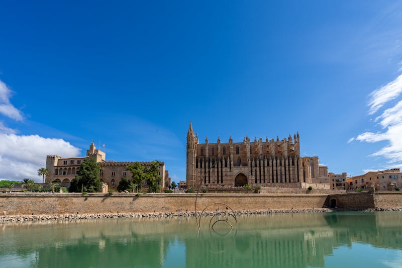 La Seu Cathedral and Almudaina Palace in Palma reflecting in the water