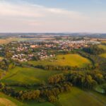Aerial photograph of a Czech village surrounded by green farmland