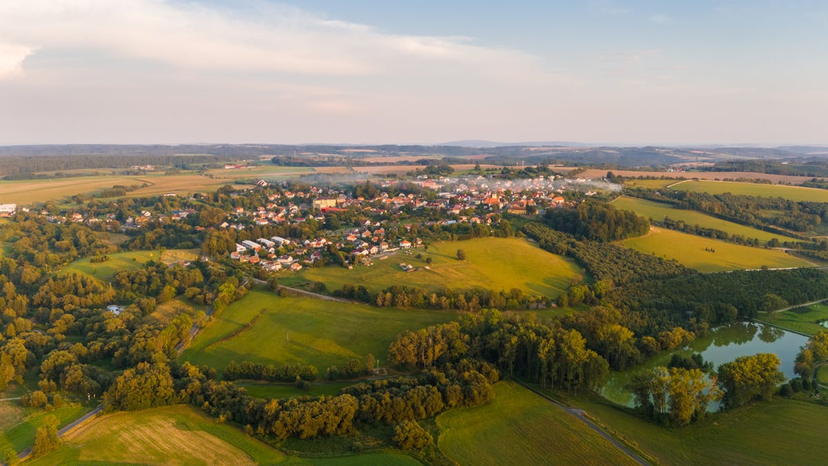 Aerial photograph of a Czech village surrounded by green farmland