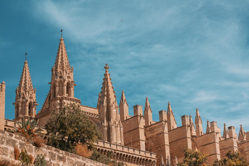Gothic spires of Palma Cathedral under a clear blue sky