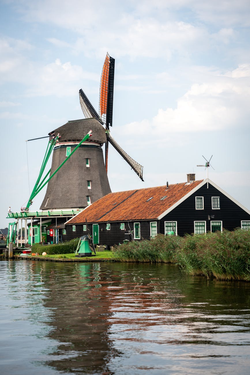 Charming Dutch windmill by water at Zaanse Schans, Netherlands