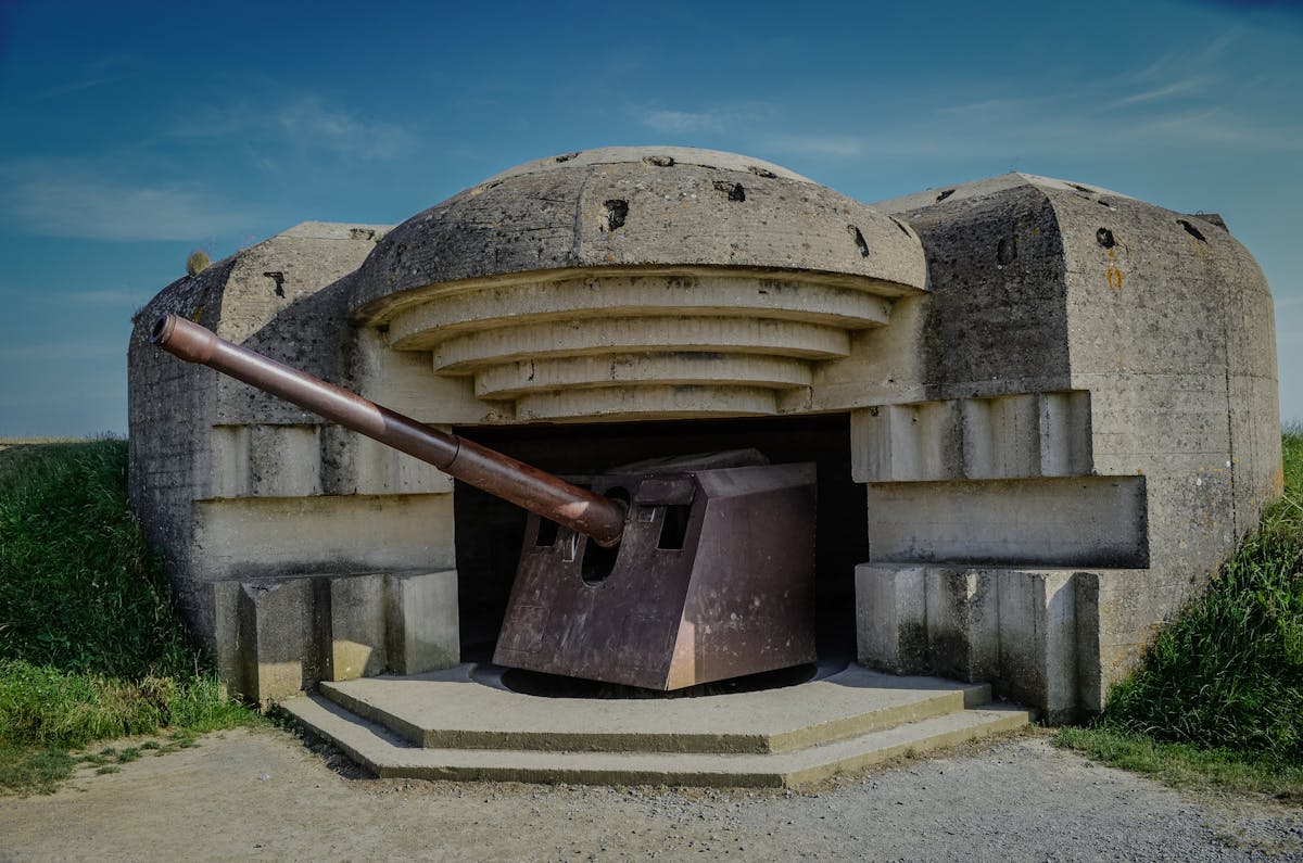 World War II German bunker with original artillery cannon at a Normandy D-Day site