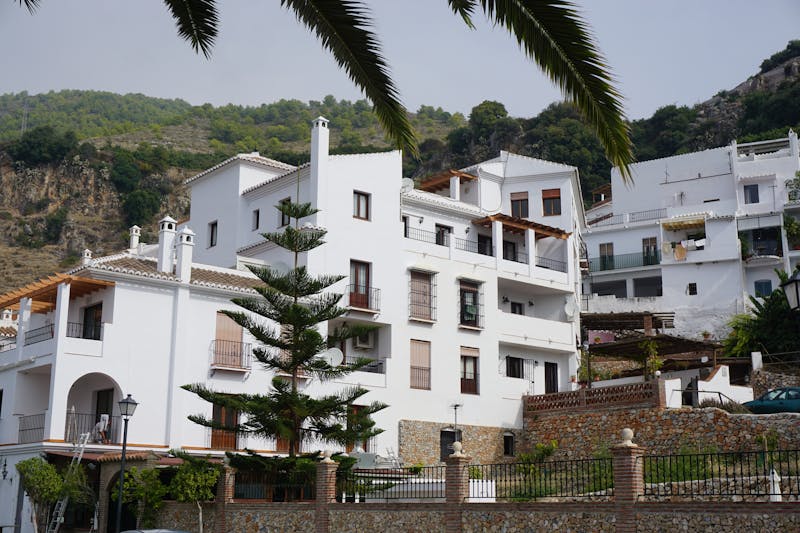White townhouses on a hillside in southern Spain showing typical Mediterranean architecture