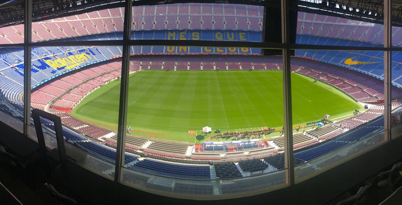 Panoramic view of Camp Nou stadium showing the full pitch and surrounding seats in Barcelona