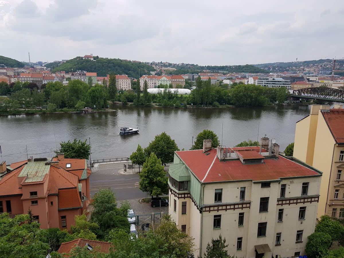 Panoramic view of Prague showing the Vltava River and historic architecture