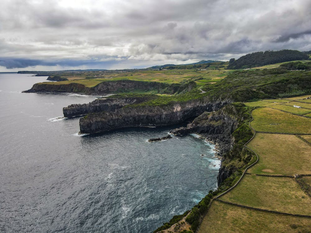 Aerial view of coastal cliffs and ocean waves at Sao Miguel, Azores