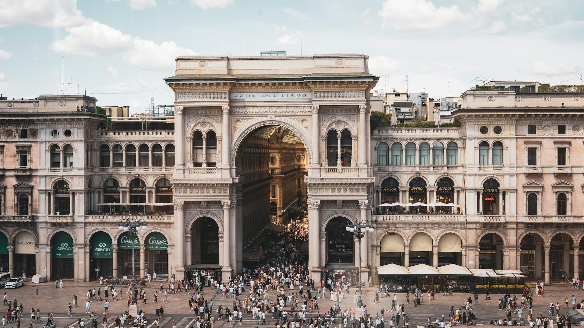 Crowds walking through Galleria Vittorio Emanuele II in Milan