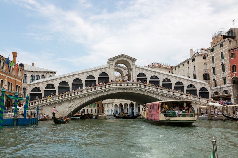Iconic Rialto Bridge spanning the Grand Canal in Venice on a sunny day