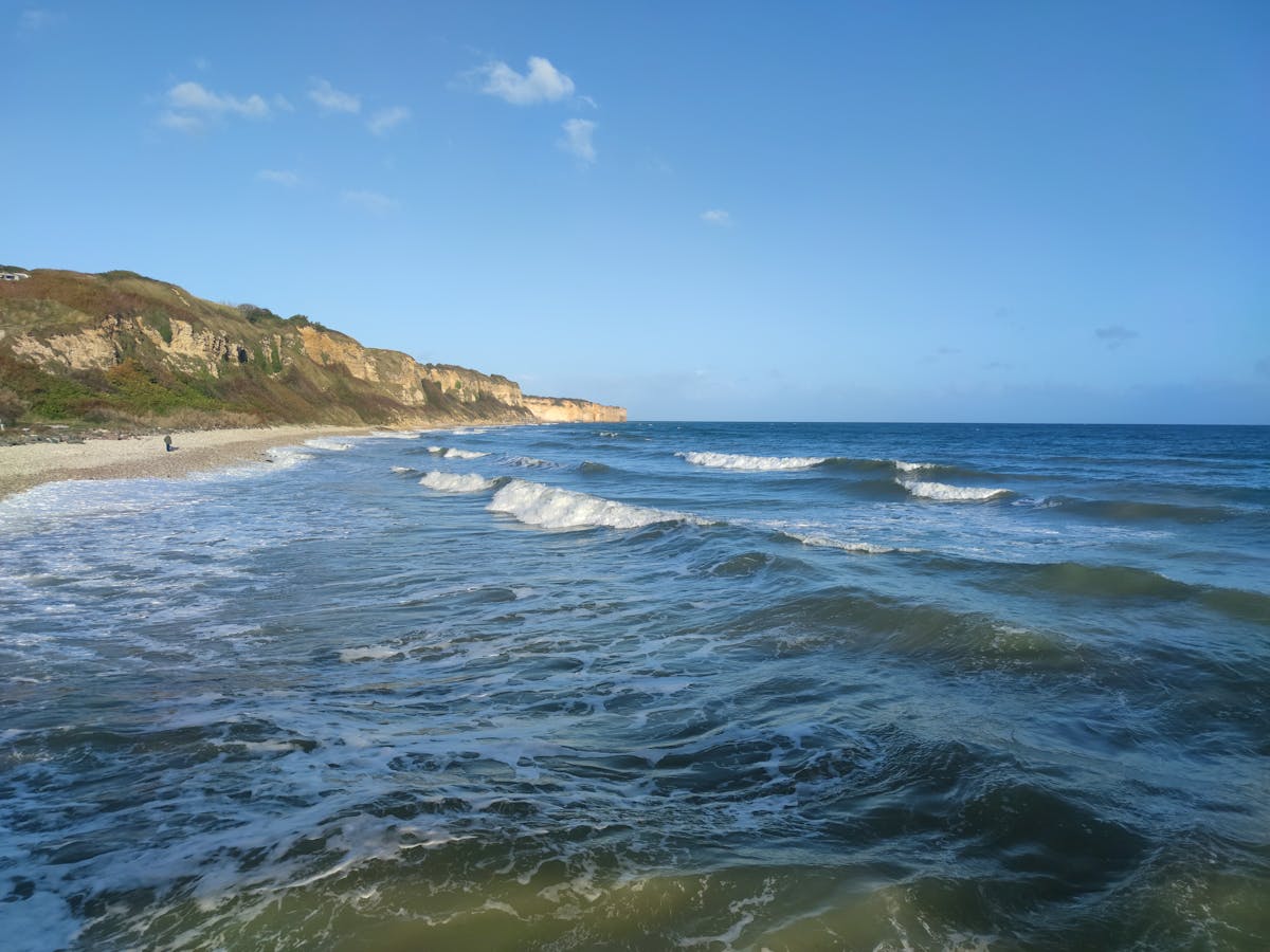 Waves breaking on the shore at Saint-Laurent-sur-Mer near Omaha Beach in Normandy