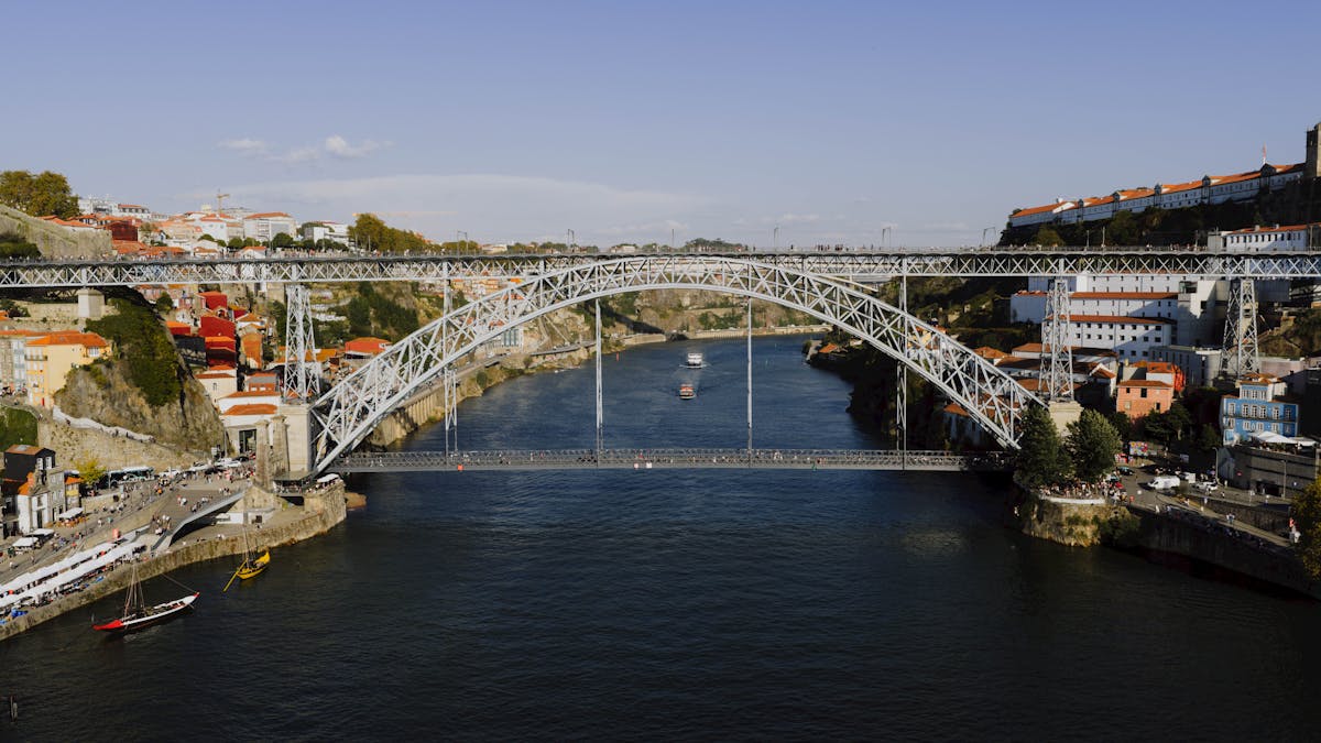 The iron Dom Luis I Bridge stretching across the Douro River connecting Porto and Vila Nova de Gaia