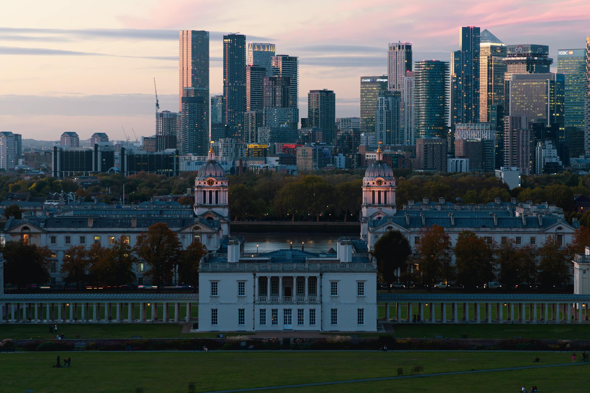 London cityscape at sunset with warm golden light reflecting on the River Thames