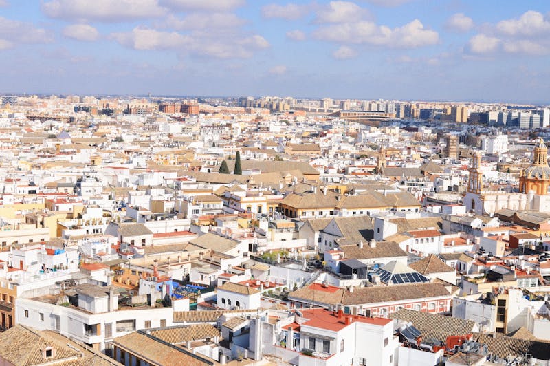 Aerial view of the historic architecture of Seville Spain including rooftops and landmarks