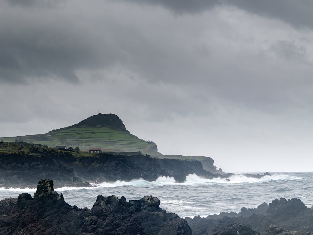 Rugged cliffs and crashing waves along the Azores coastline