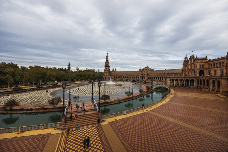 Aerial view of Plaza de Espana in Seville showing the semicircular building and canal