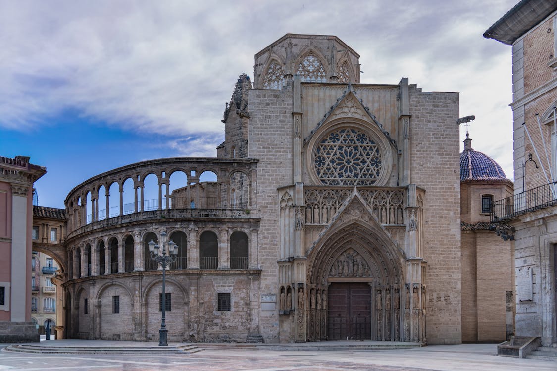 The gothic facade of Valencia Cathedral against a blue sky