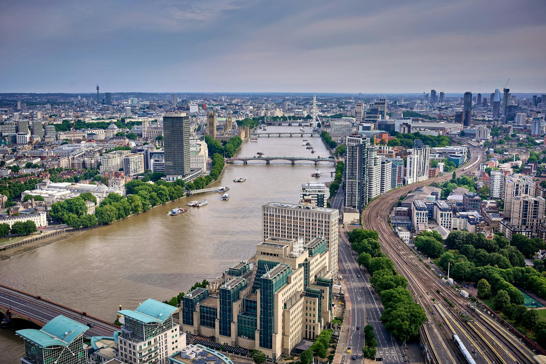 Aerial photograph of London skyline with the Thames River, showing modern and historic buildings